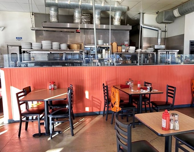 The open kitchen design invites you to witness culinary magic happening behind that coral-colored counter&mdash;dinner and a show, breakfast edition.