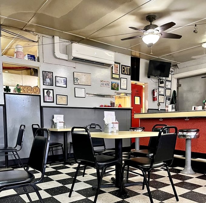 Black and white checkered floors, red counter, ceiling fans spinning stories overhead. Diners haven't changed because they never needed to.