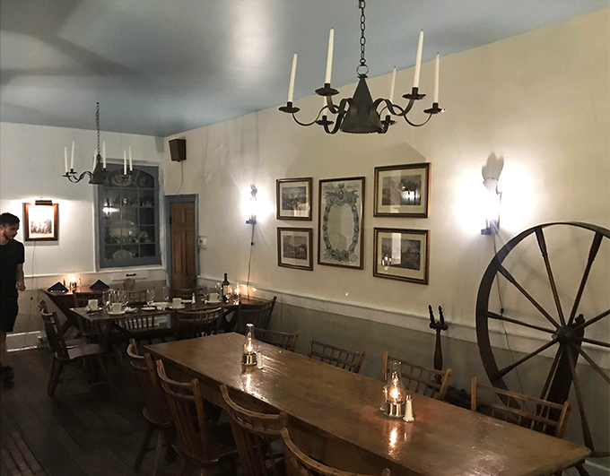 Colonial charm meets modern comfort in this dining room where spinning wheels and candlelight remind you that good taste never goes out of style.
