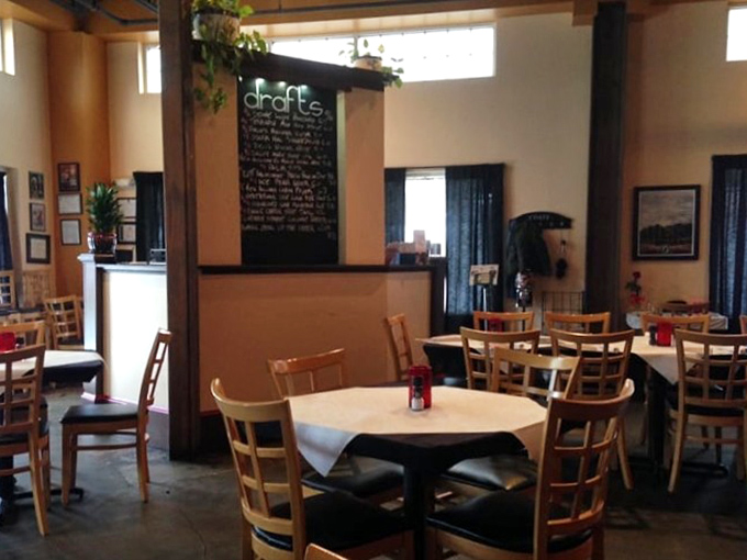 The dining room where conversations flow as smoothly as the wine. That chalkboard isn't just decor—it's a billboard advertising liquid happiness.