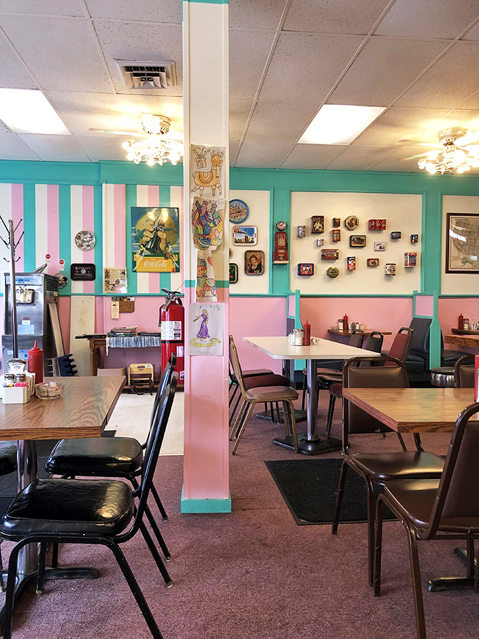 The dining room feels like your favorite aunt's kitchen got an expansion permit. Those striped walls and vintage decorations aren't kitsch&mdash;they're character.