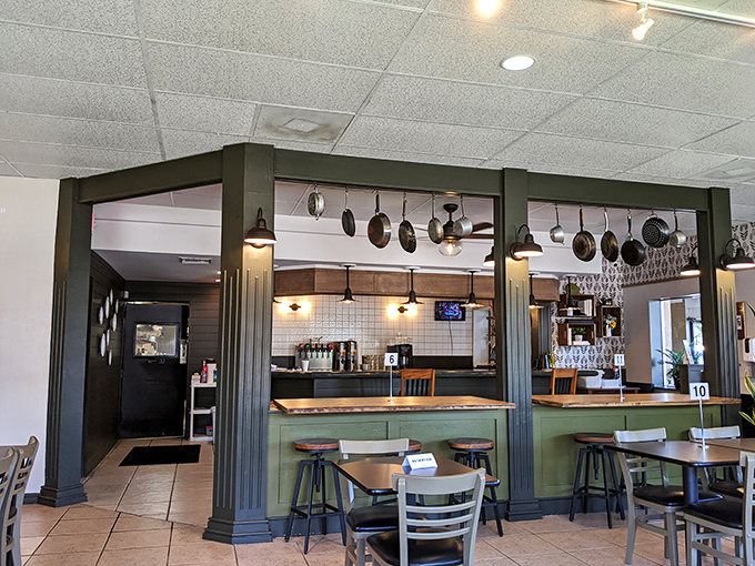 The kitchen pass offers a front-row seat to culinary theater. Those hanging pots aren't just decoration&mdash;they're promises of good things to come.