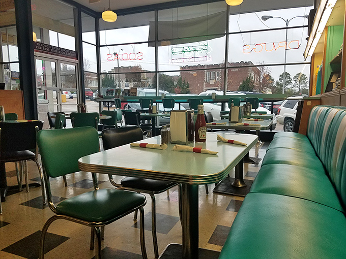 The checkerboard floor and turquoise booths aren't retro by design&mdash;they're authentic by survival, outlasting decades of dining trends.