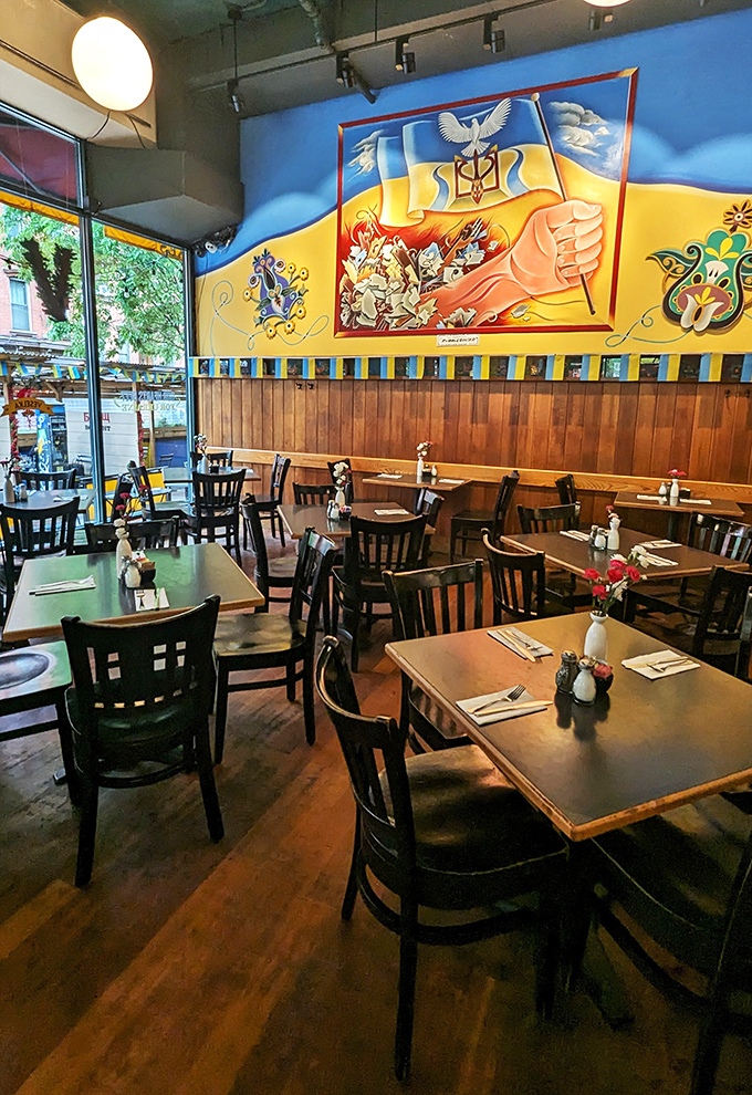 Morning light streams through windows illuminating the dining room where Ukrainian art tells stories while diners create their own over plates of comfort.