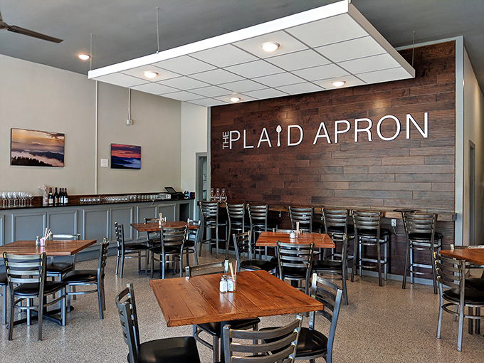 The wood accent wall isn't just decoration&mdash;it's a statement. "We care about details," it whispers, while pendant lights cast a golden glow.