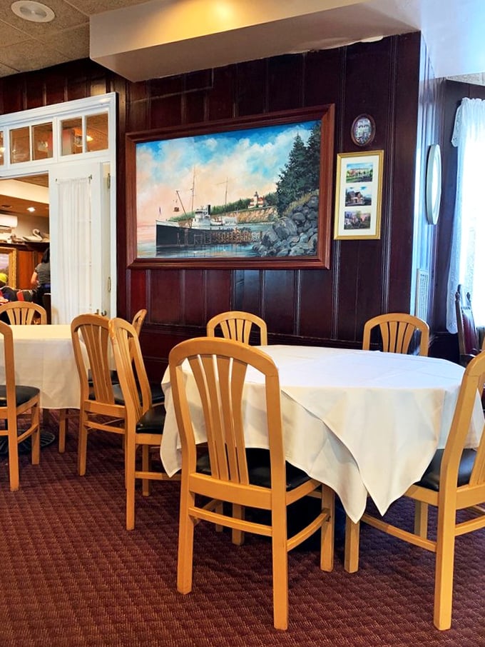 Maritime paintings against rich wood paneling tell stories of Chesapeake Bay's past, while white tablecloths silently promise memorable meals in your immediate future.