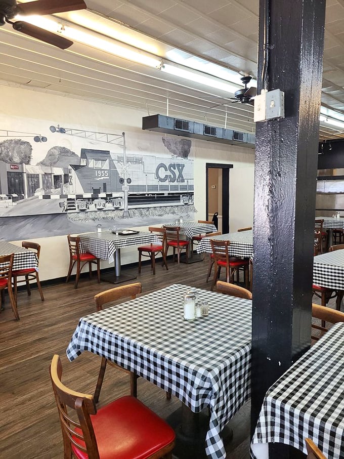 The dining room where conversations flow as freely as the gravy, under the watchful eye of a CSX train that never leaves the station.
