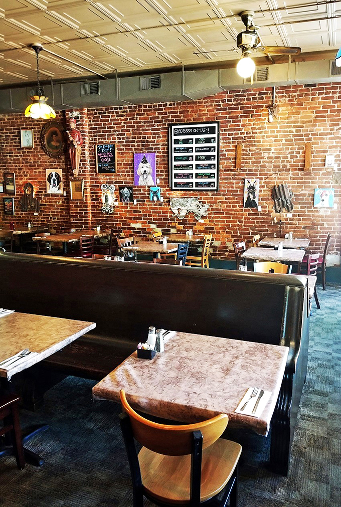 Where art meets appetite—local pet portraits adorn brick walls while diners below contemplate the most important masterpiece: what to order for lunch.