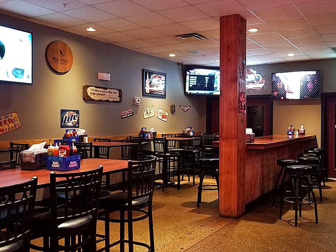 Wood accents and beer signs create that perfect "come as you are" atmosphere. BBQ democracy in action&mdash;everyone's welcome at this table.