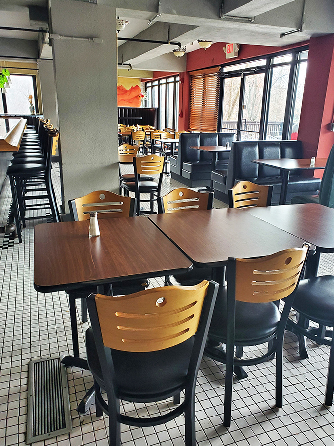 A dining room that says "stay awhile" without being clingy about it. Those wooden chairs have cradled more happy diners than a Thanksgiving table.