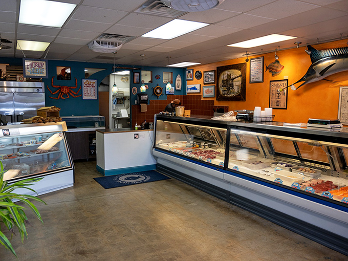The seafood counter where dreams and dinner plans collide. That marlin on the wall has seen some serious food envy.