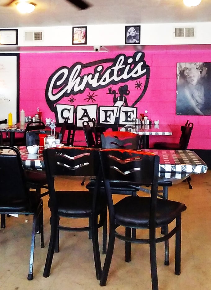 The vibrant pink logo wall isn't just decoration&mdash;it's a mission statement: We're bold, we're proud, and we're serious about comfort food.