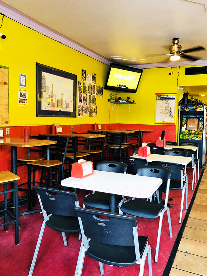 The dining room says, "Stay awhile," with its unpretentious charm and vintage arcade game standing guard in the corner.