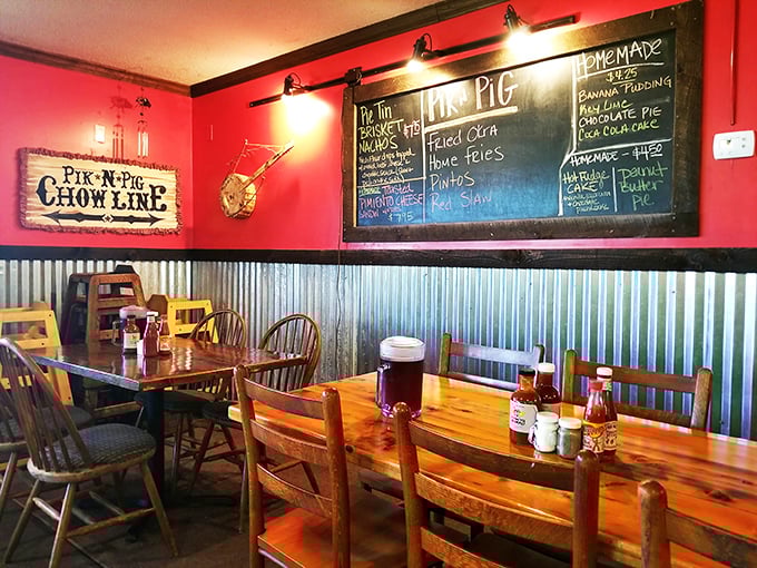 Red walls, corrugated metal wainscoting, and a chalkboard menu&mdash;barbecue joint design 101, executed with the confidence of an A+ student.
