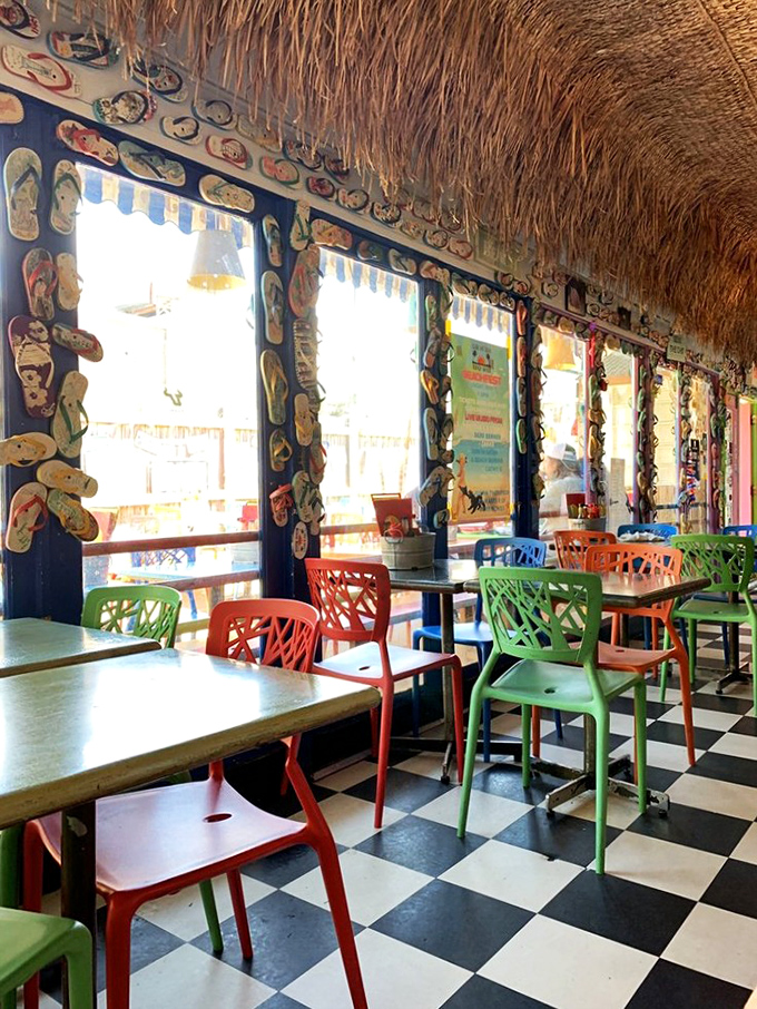 Flip-flops line the windows while thatched roofing and checkerboard floors transport you straight to Key West. No passport required.