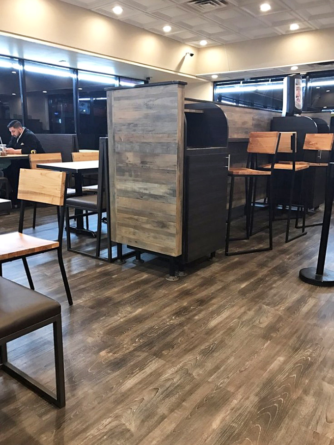 Modern rustic meets comfort food haven. Those wooden dividers aren't just stylish—they're strategic for when you need privacy with your chicken.