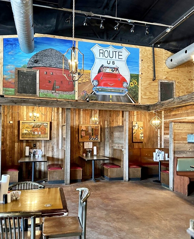 Route 66 memorabilia watches over diners like friendly ghosts of road trips past. The mural says "Americana" without needing words.