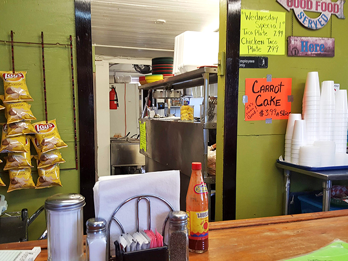 The kitchen pass-through offers a glimpse into where the magic happens. Those Lay's bags aren't just decoration&mdash;they're frito pie ingredients.