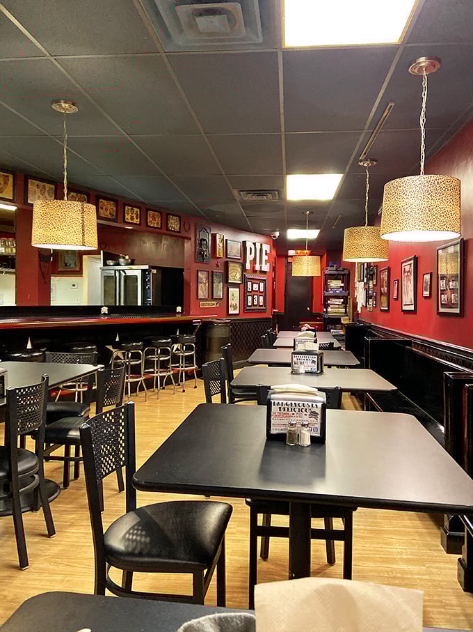 Pendant lights cast a warm glow over Baltimore's pie sanctuary. The red walls aren't just decor&mdash;they're a warning that passion for pie happens here.