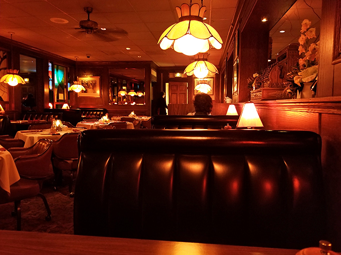 The dining room's warm glow transforms dinner into an event, making Tuesday night feel like your anniversary.