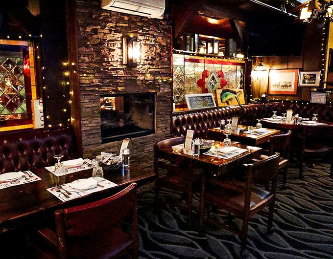 The dining room feels like it's been waiting just for you &ndash; warm lighting, stone fireplace, and tables spaced for conversation rather than eavesdropping.