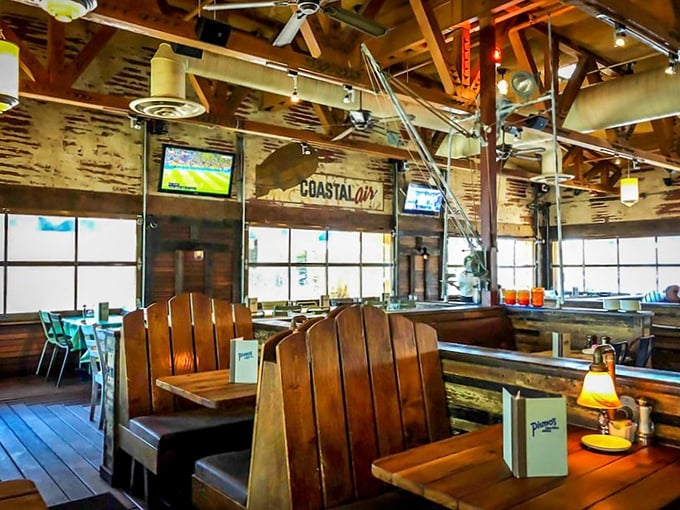 Wooden booths bathed in natural light create that "coastal casual" vibe. The only thing missing is the sound of seagulls trying to steal your fries.