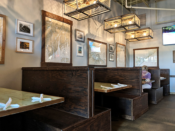 Wooden booths that whisper "stay awhile." Rustic charm meets maritime maps in a dining room designed for lingering conversations and second helpings.