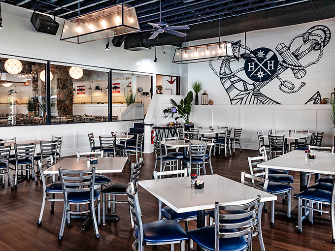 Clean lines, coastal colors, and that statement anchor logo. The dining room balances nautical themes without veering into "captain's quarters at Disney" territory.