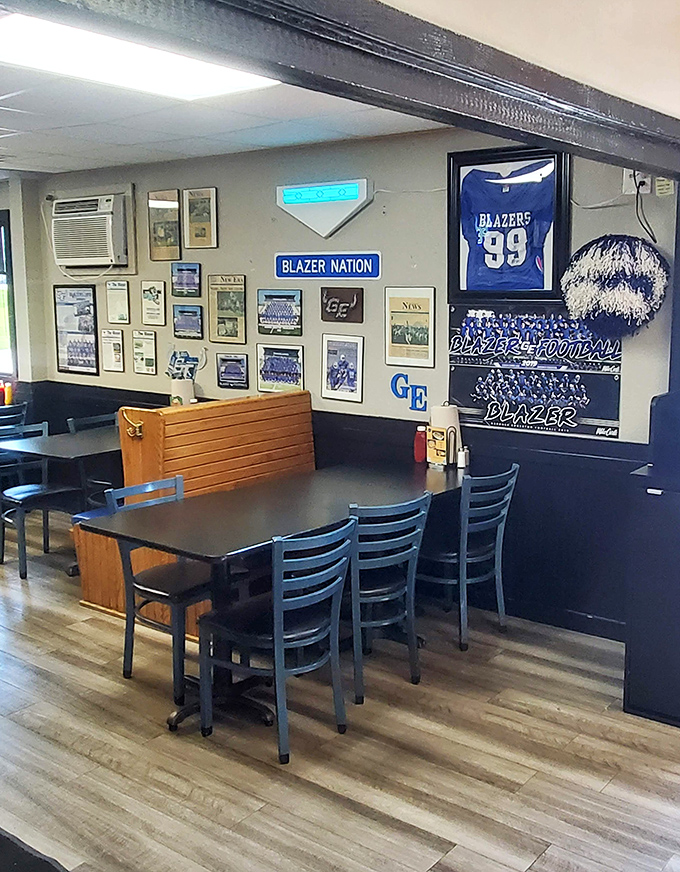 Blue and white dominates the dining area, where televisions stand ready to broadcast local sports victories while regulars claim their usual tables.