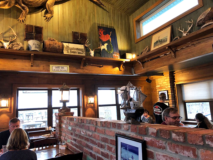 Taxidermy meets brick dividers in an interior that says, "Yes, we know exactly what we're doing with seafood."