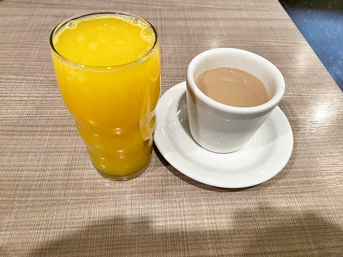 The classic breakfast power couple: fresh-squeezed orange juice and coffee, ready to transform you from zombie to functioning human.