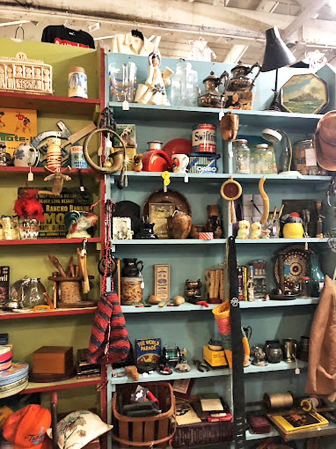 Mannequin heads modeling decades of hat fashion create an oddly charming welcoming committee to the accessories department. 