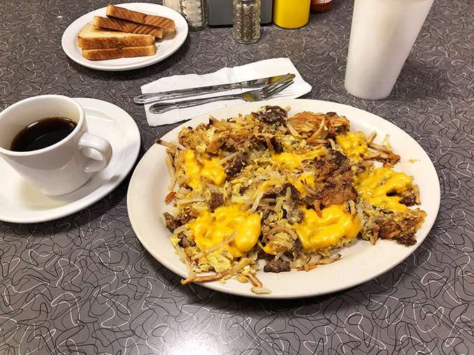 This isn't just breakfast&mdash;it's a sunrise on a plate. Hash browns and melted cheese creating little pools of morning joy.