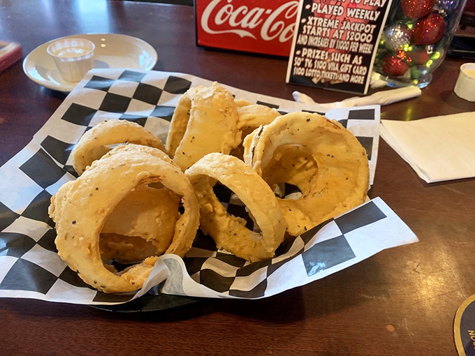 Golden halos of onion ring perfection &ndash; crispy, light batter giving way to sweet onion that practically melts on your tongue. 