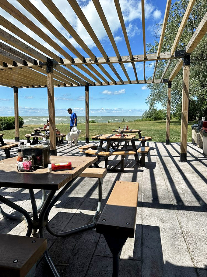Lakeside dining that soothes the soul. These picnic tables under wooden pergolas offer views that pair perfectly with anything on the menu.