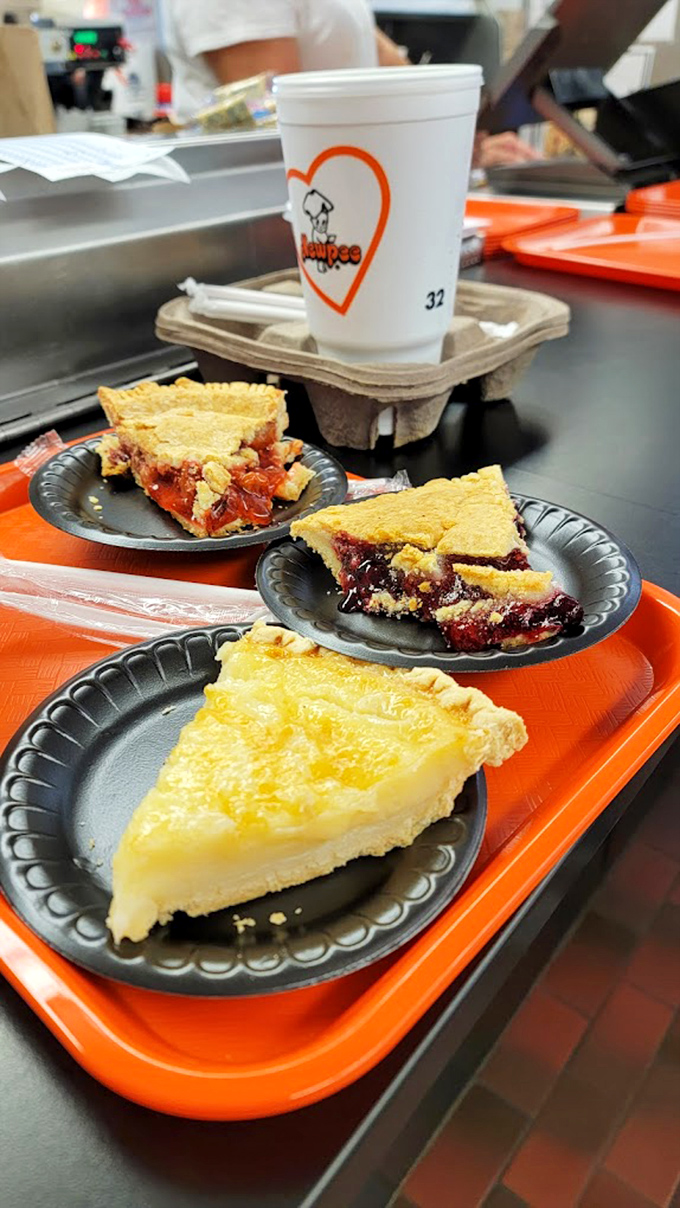 Three slices of heaven on small black plates&mdash;fruit pies that would make your grandmother simultaneously proud and a little jealous.