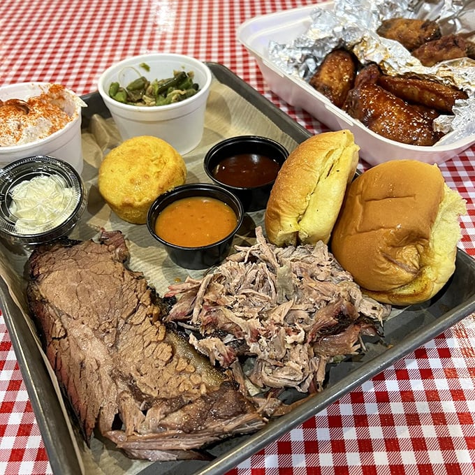 The barbecue sampler that silences the "I can't decide" dilemma&mdash;brisket, pulled pork, and all the fixings on one glorious tray.