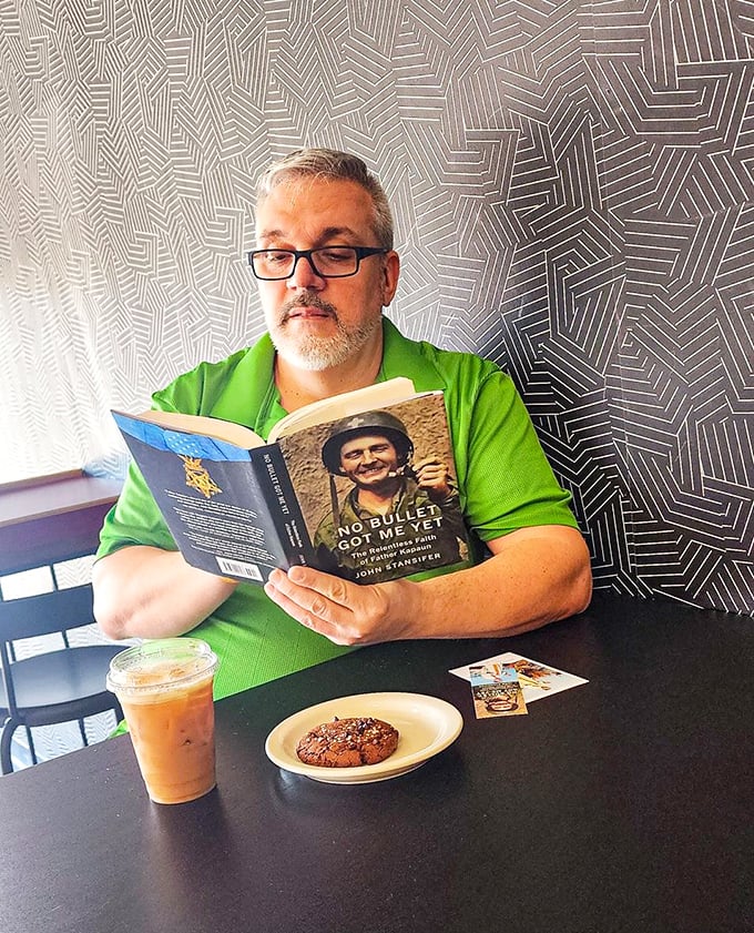 The perfect trifecta: a good book, iced coffee, and a cookie. Some call it lunch; I call it salvation.