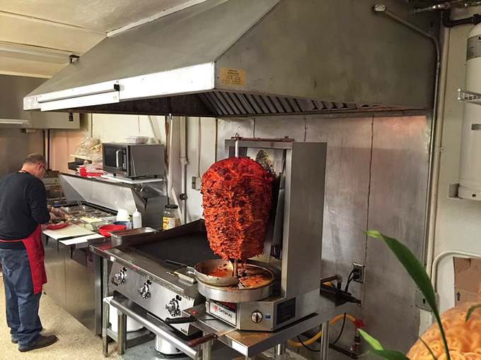 That towering trompo of al pastor is basically a rotating monument to deliciousness, slowly spinning and developing flavor like a meaty work of art.
