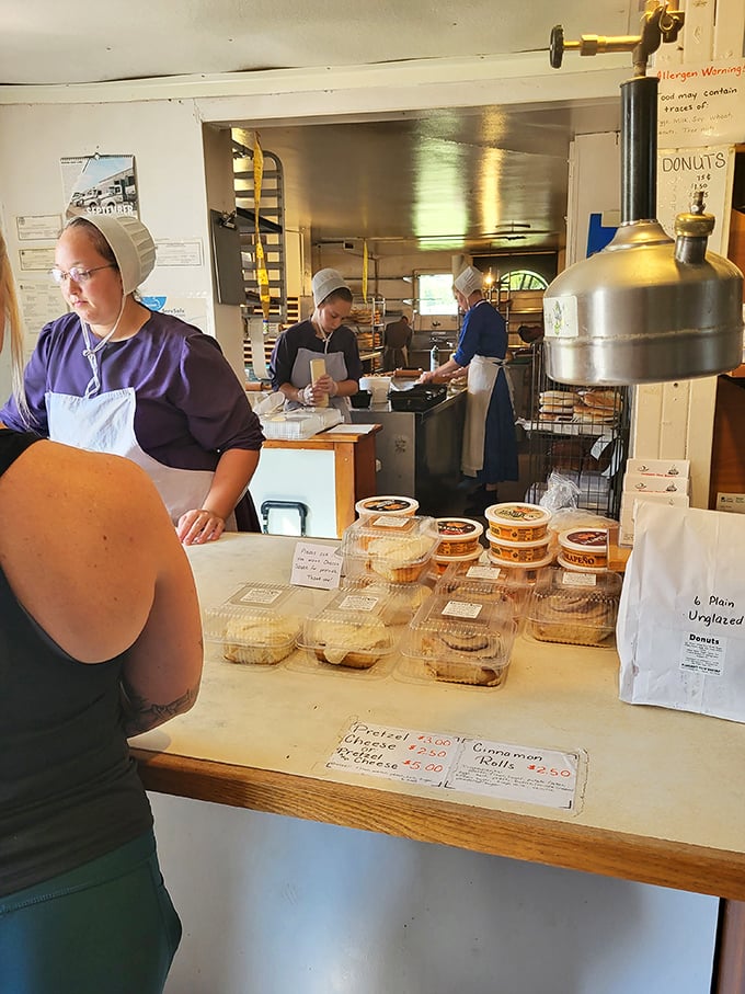 The bakery staff works with the focused precision of symphony musicians, except their instruments produce something far more satisfying than Mozart ever could.