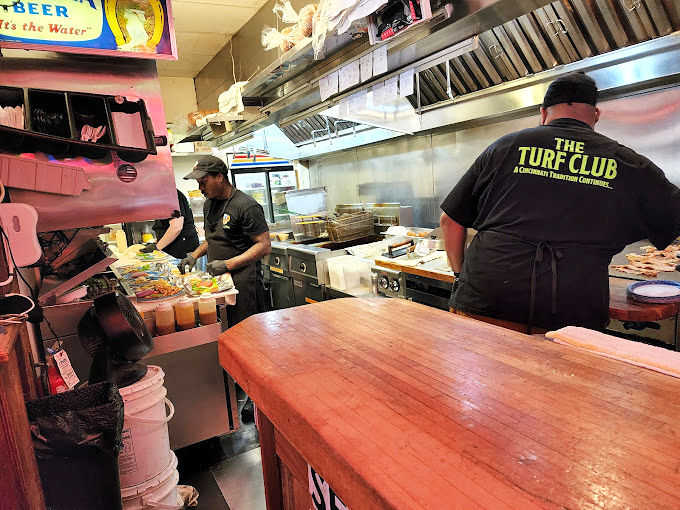 Where the magic happens. The kitchen crew works their alchemy in a space that's all business amid the surrounding whimsy.