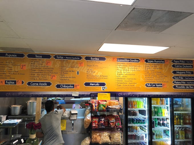 The colorful menu looms above like the scoreboard at a delicious sporting event where everyone wins, especially your taste buds.