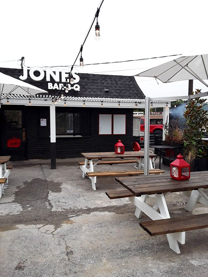 The outdoor dining area isn't trying to impress anyone, which is exactly why it's so charming. String lights add just enough magic.