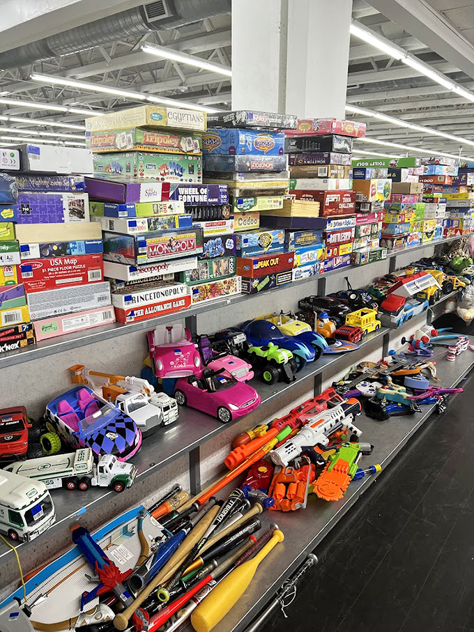 Board games stacked higher than your childhood memories, with toy cars below that would make any collector's heart race faster than a Hot Wheels track.