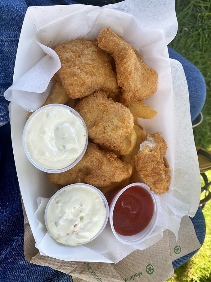 The cross-section reveals all: flaky white albacore encased in a golden armor of crispy batter. Worth every minute in line.