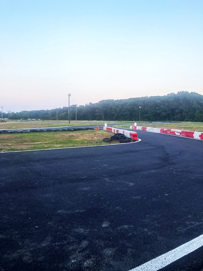 The track at dusk takes on an almost magical quality. Those red and white barriers aren't just pretty&mdash;they're there to keep your ambition in check.