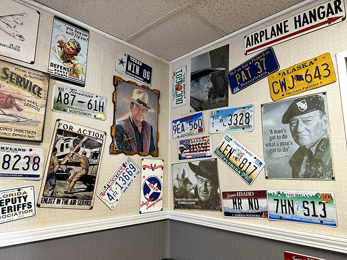 License plates and nostalgia cover every inch. This isn't decoration—it's a museum of Americana where you can also order pancakes.