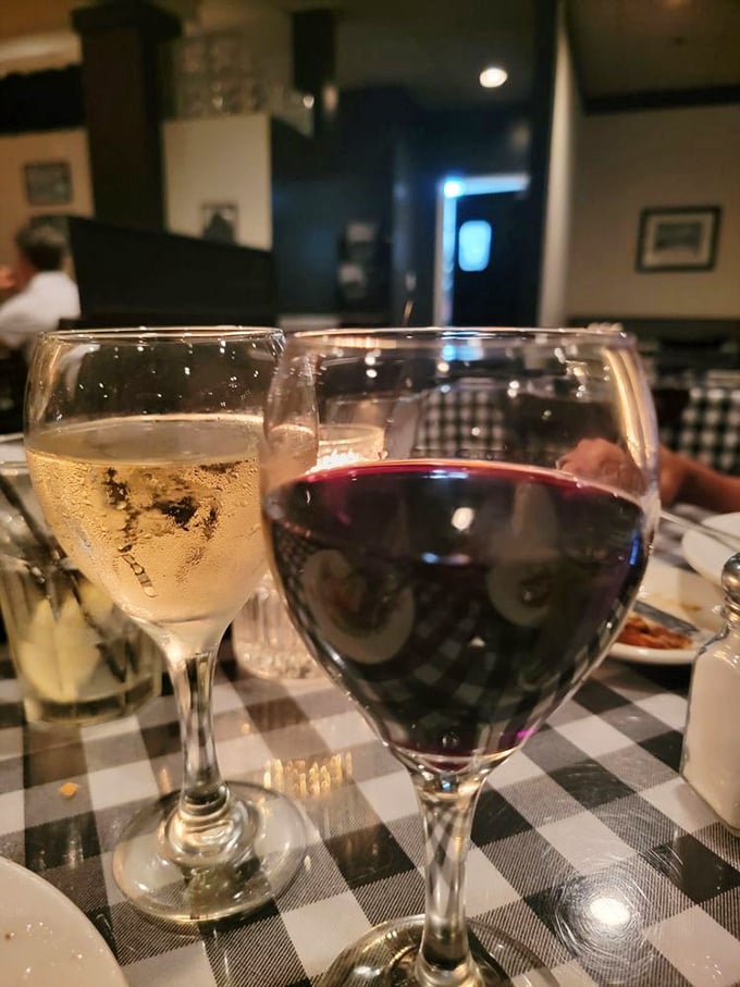 Red and white wine glasses catching the light like liquid jewels. The perfect companions for that steak you're about to devour with reckless abandon.