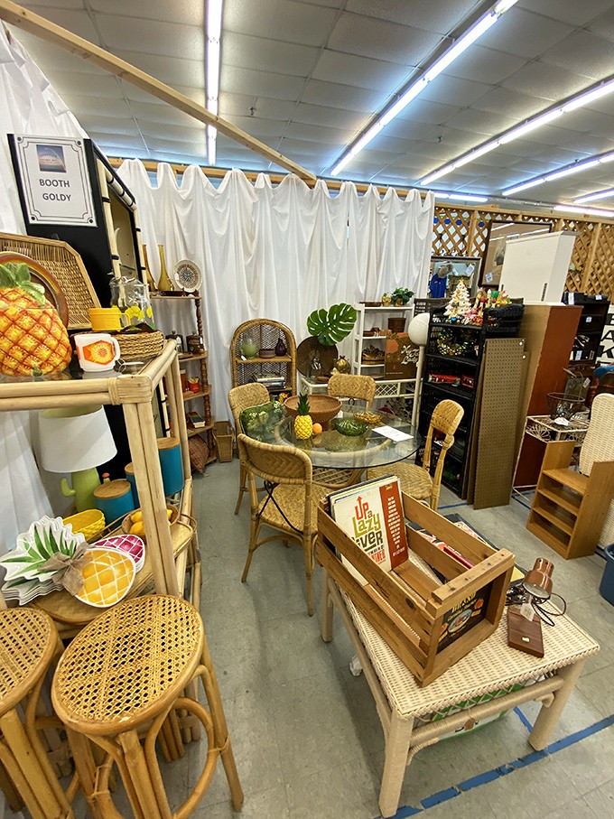 Tropical vibes meet mid-century design in this booth. The pineapple motifs say "Florida" without a single flamingo in sight.