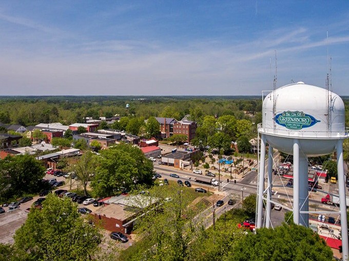 Greensboro's water tower stands sentinel over a downtown that perfected the art of unhurried Southern living.